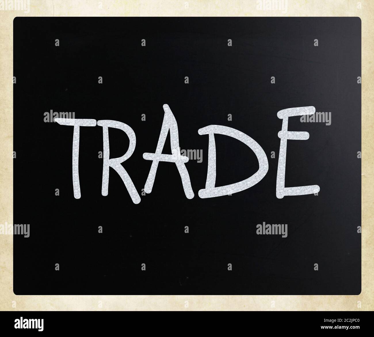 "Trade" handwritten with white chalk on a blackboard Stock Photo - Alamy