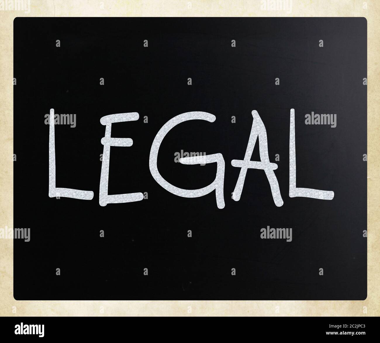 The word "Legal" handwritten with white chalk on a blackboard Stock ...