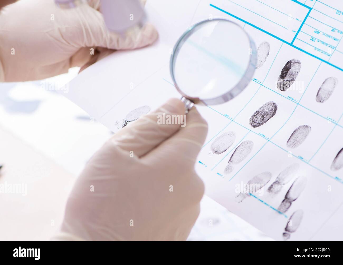 The forensic expert studying fingerprints in the lab Stock Photo - Alamy