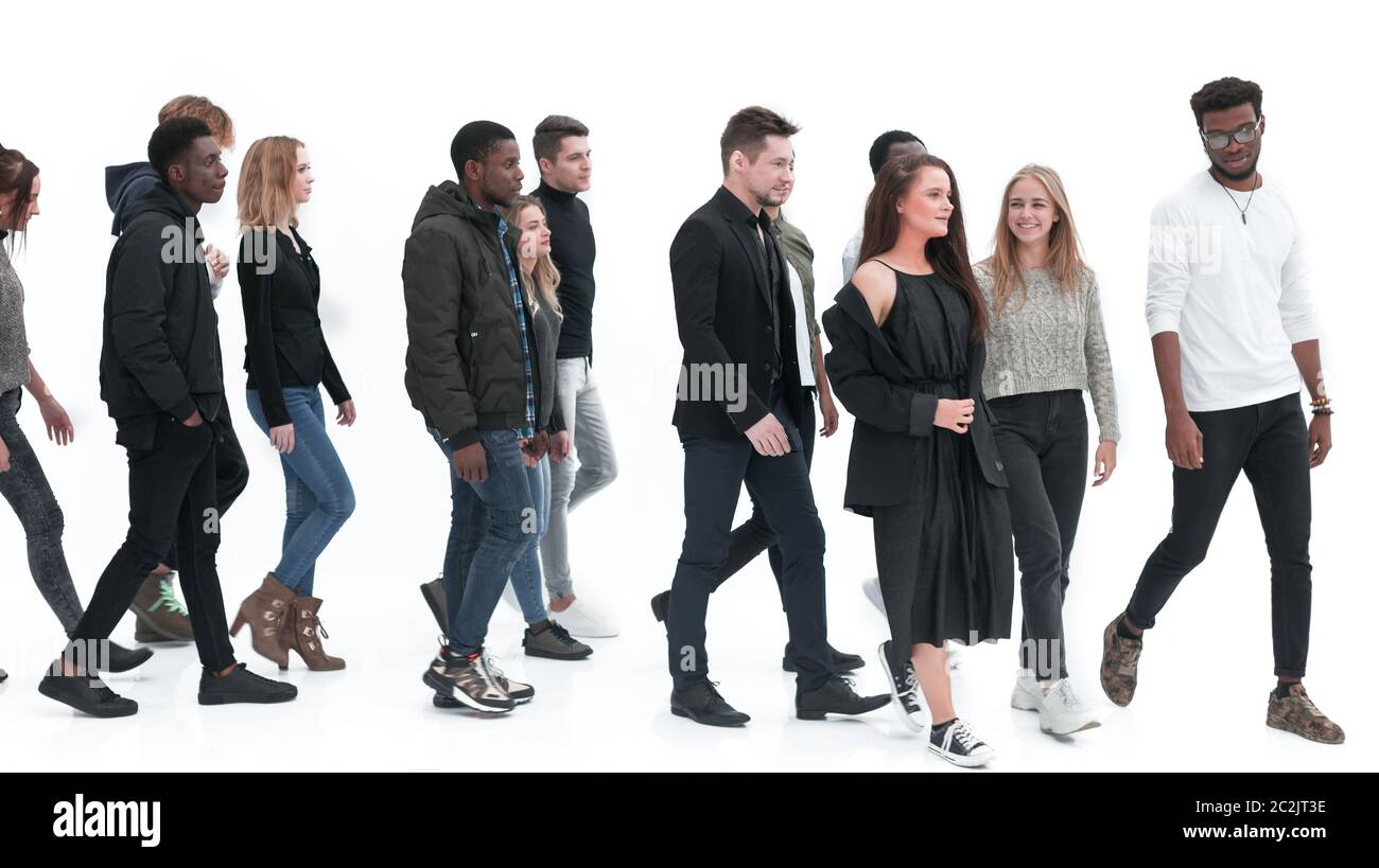 group of diverse young people walking one after the other Stock Photo ...
