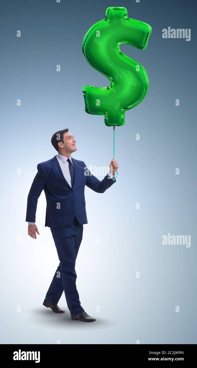 The businessman walking with inflatable dollar sign Stock Photo - Alamy