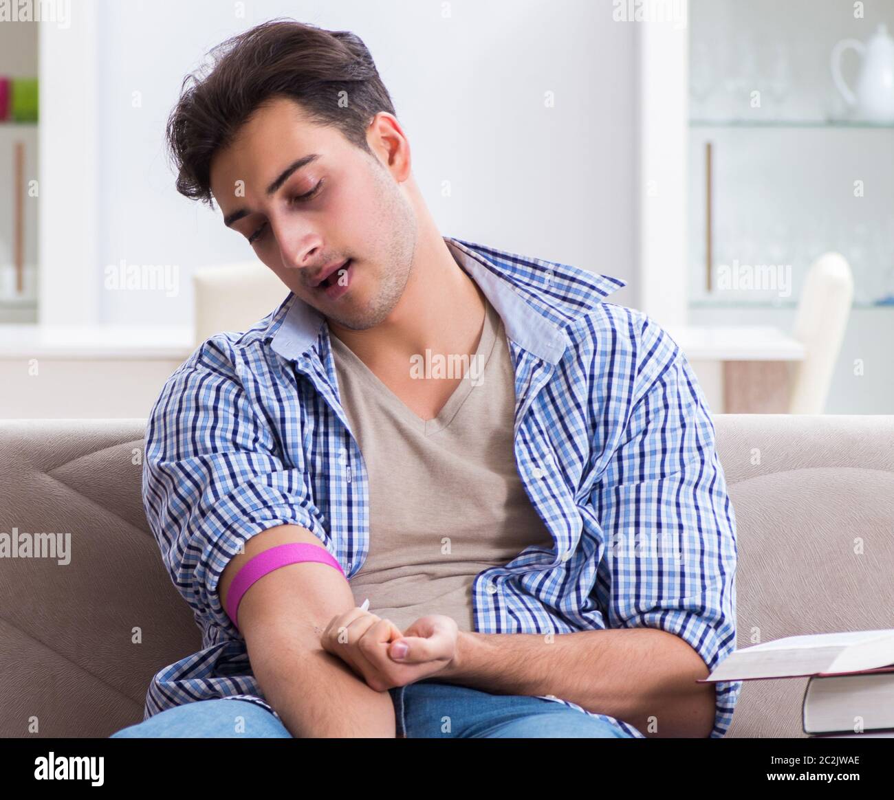 Young student suffeting from drug addiction Stock Photo - Alamy