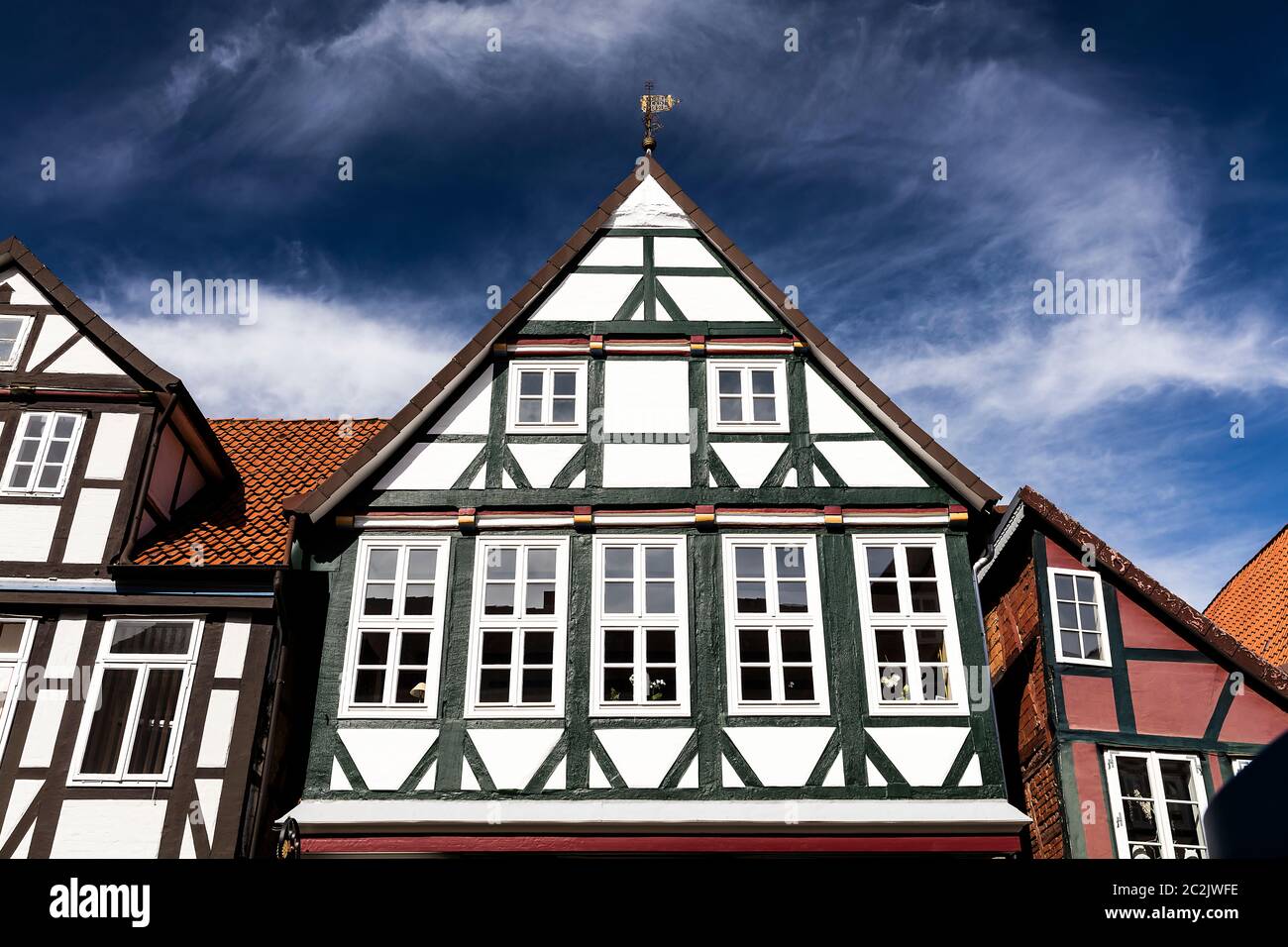 Half-timbered gable with wooden windows of an old half-timbered house ...