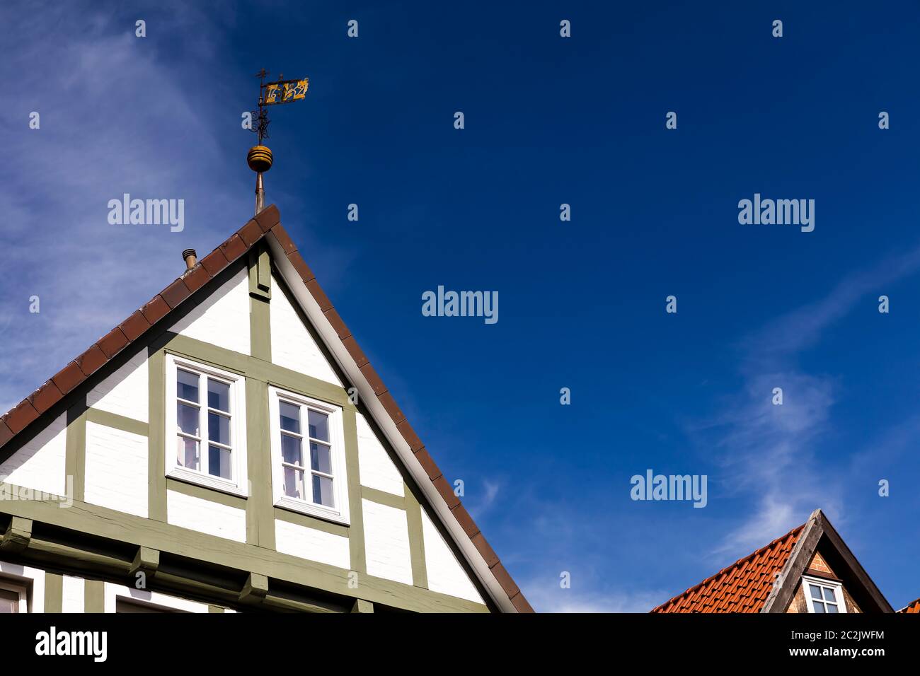 Half-timbered gable with wooden windows of an old half-timbered house ...