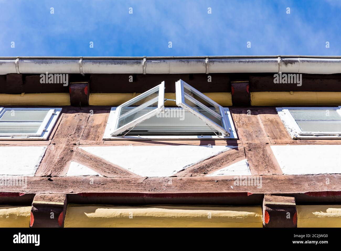 Half-timbered gable with wooden windows of an old half-timbered house ...