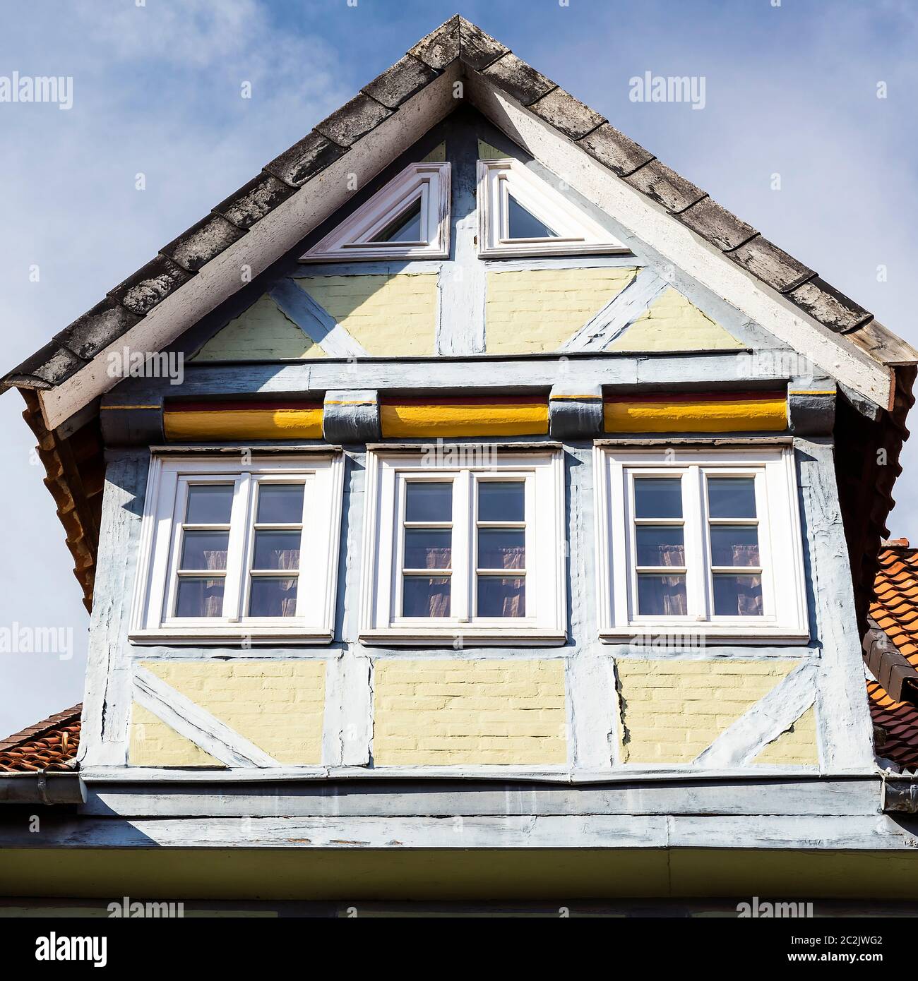 Half-timbered gable with wooden windows of an old half-timbered house ...