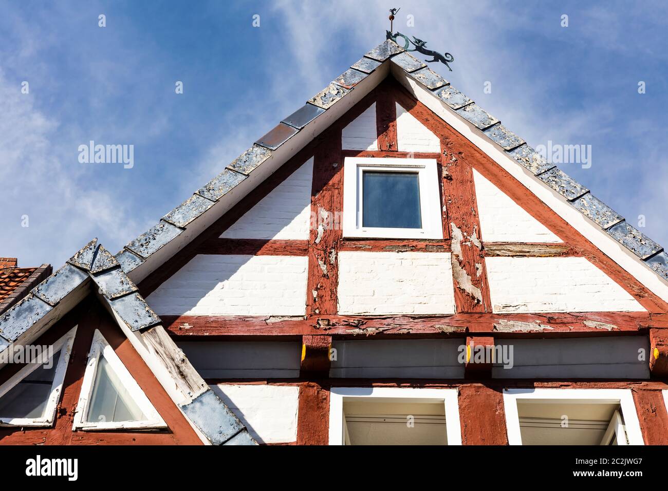 Half-timbered gable with wooden windows of an old half-timbered house ...