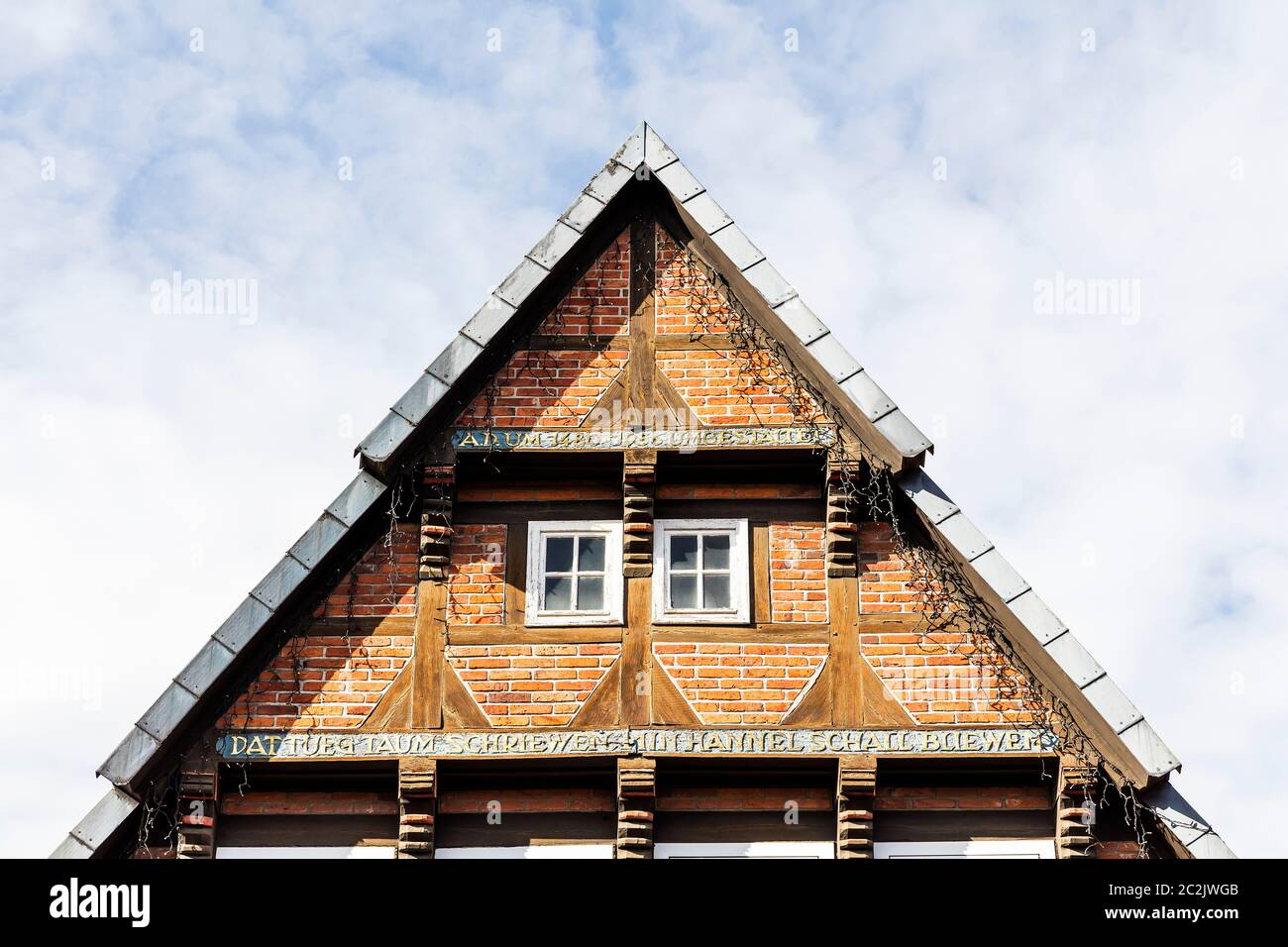 Half-timbered gable with wooden windows of an old half-timbered house ...