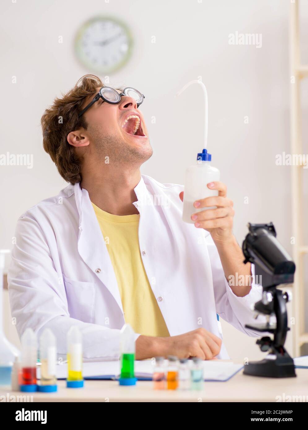 The funny crazy chemist doing experiments and tests Stock Photo - Alamy