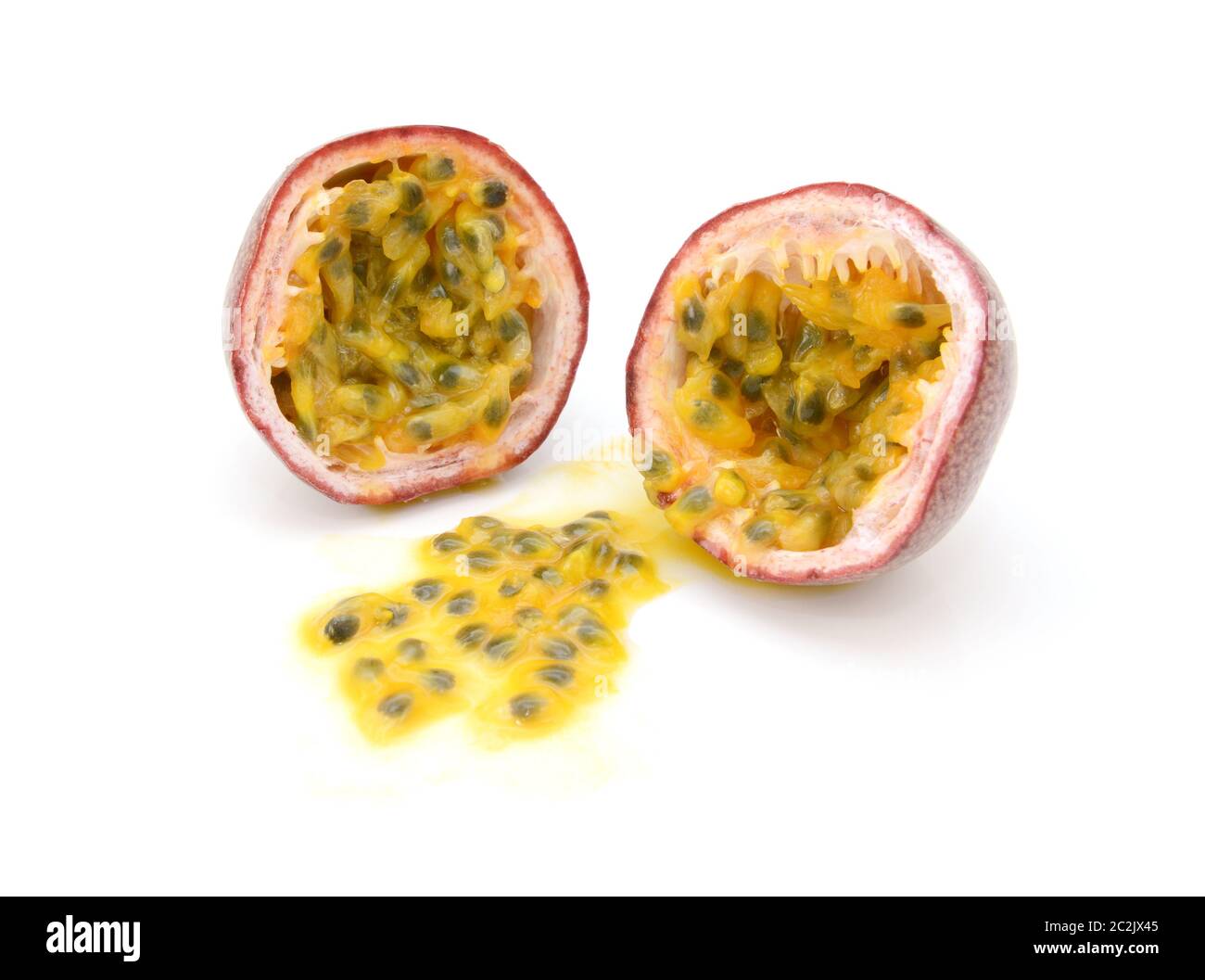 Passion fruit cut in half with juicy yellow pulp and seeds, on a white background Stock Photo ...