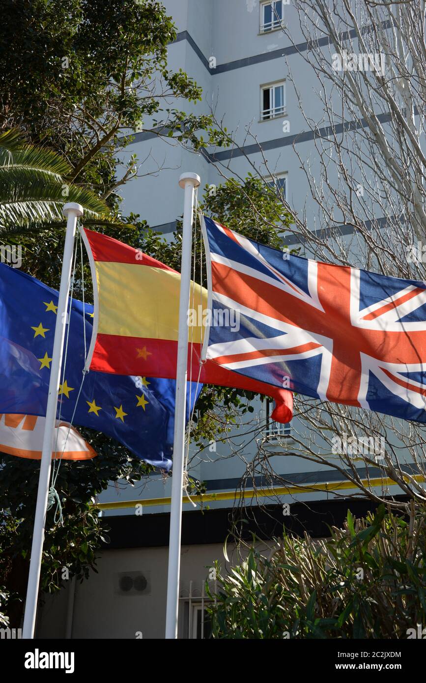 Flags in the wind: Europe, Spain, Great Britain (Union Jack) on the ...