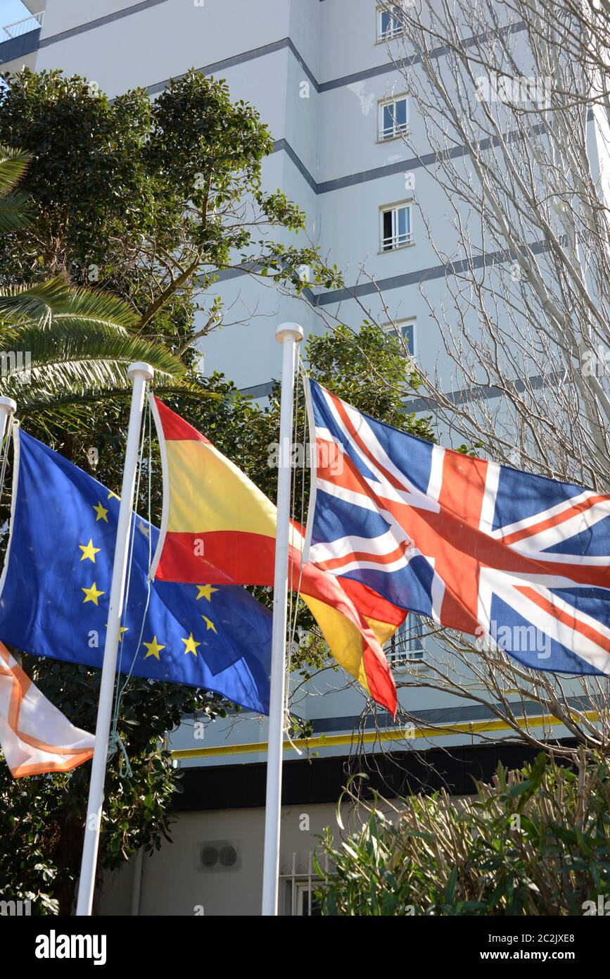 Flags in the wind: Europe, Spain, Great Britain (Union Jack) on the ...