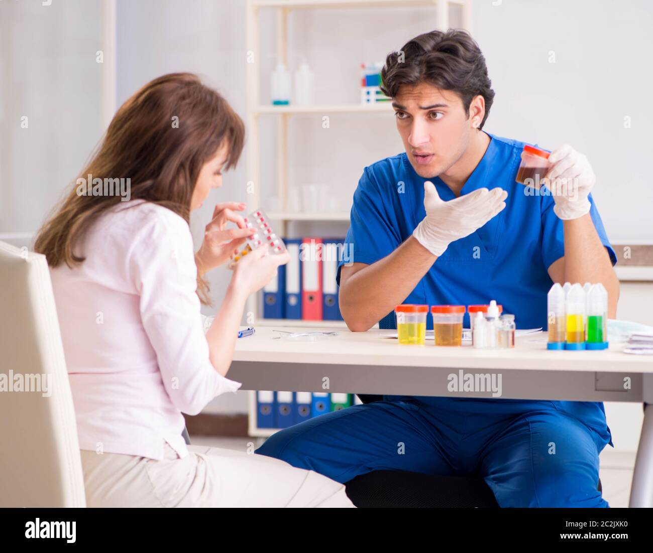 The patient visiting doctor for urine test Stock Photo - Alamy