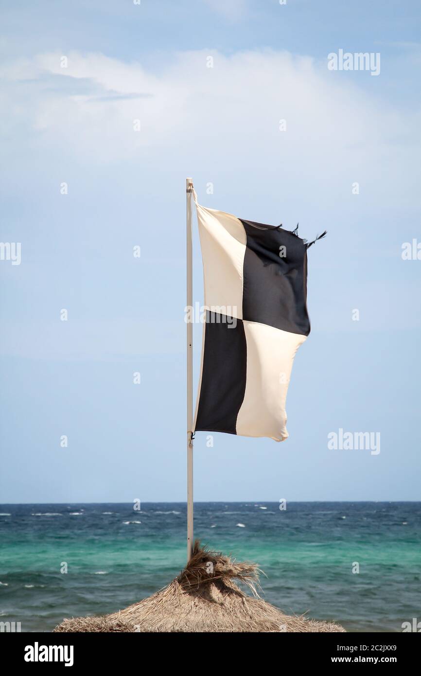 flags on the beach indicate dangers Stock Photo - Alamy