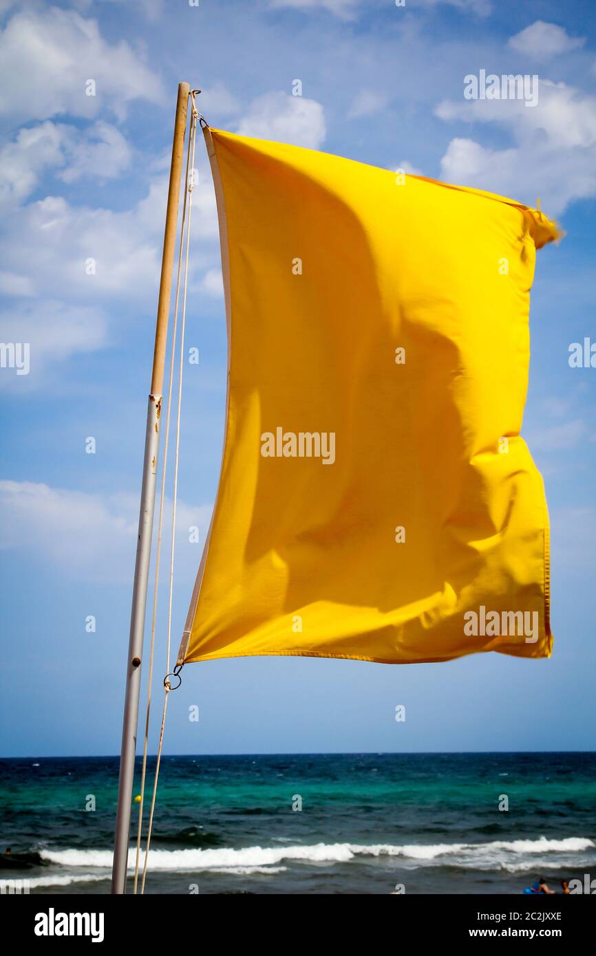 flags on the beach indicate dangers Stock Photo - Alamy