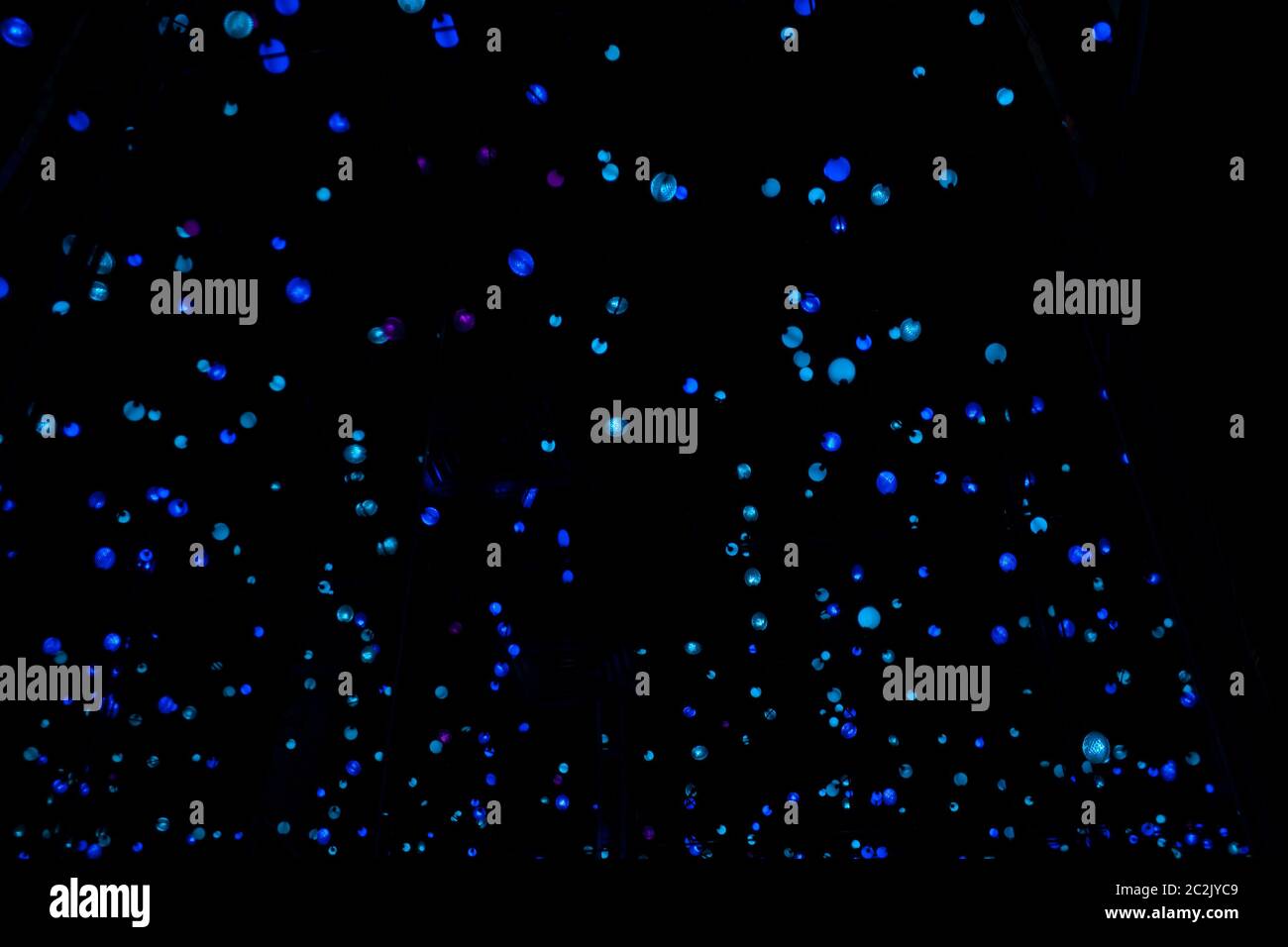 Blue lights on black background illuminating in the dark Stock Photo ...