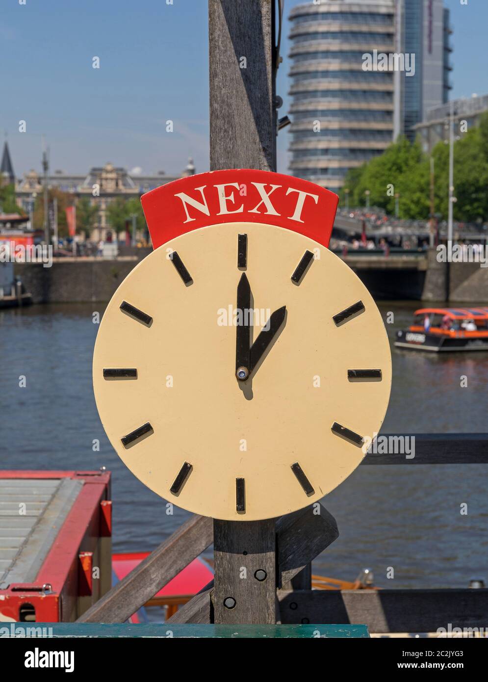 Big Round Analog Clock With Next Time Stock Photo - Alamy