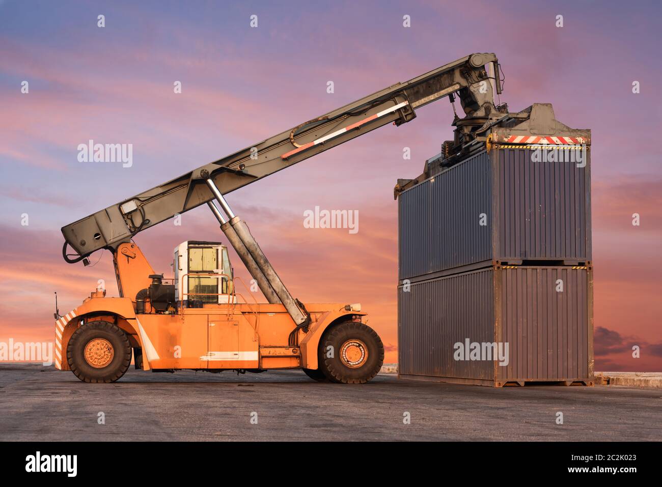Forklift handling container box loading at the Docks with Truck Stock ...