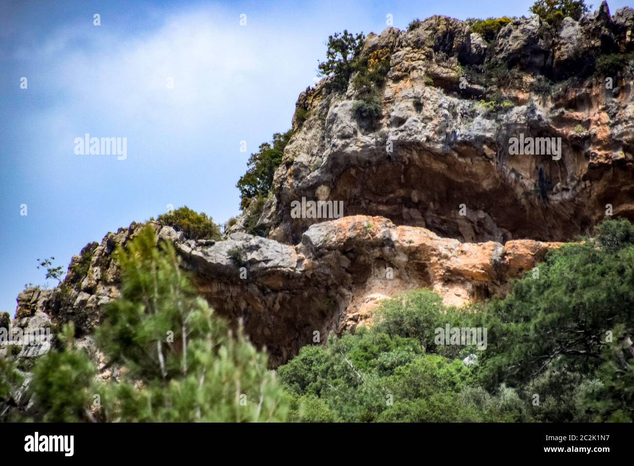 Caves in the limestone mountains. Void in the rock mountain Stock Photo ...