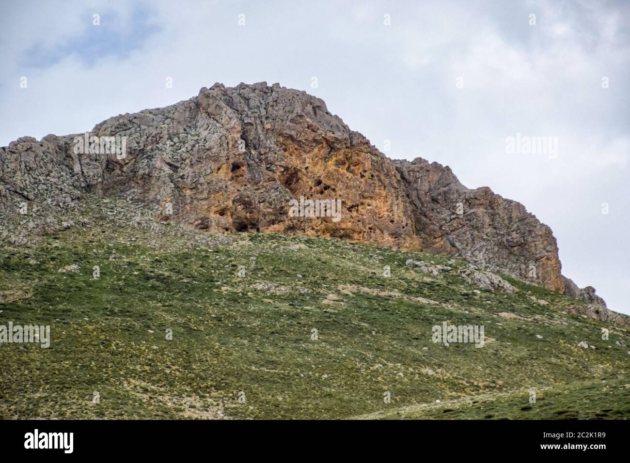 Caves in the limestone mountains. Void in the rock mountain Stock Photo ...