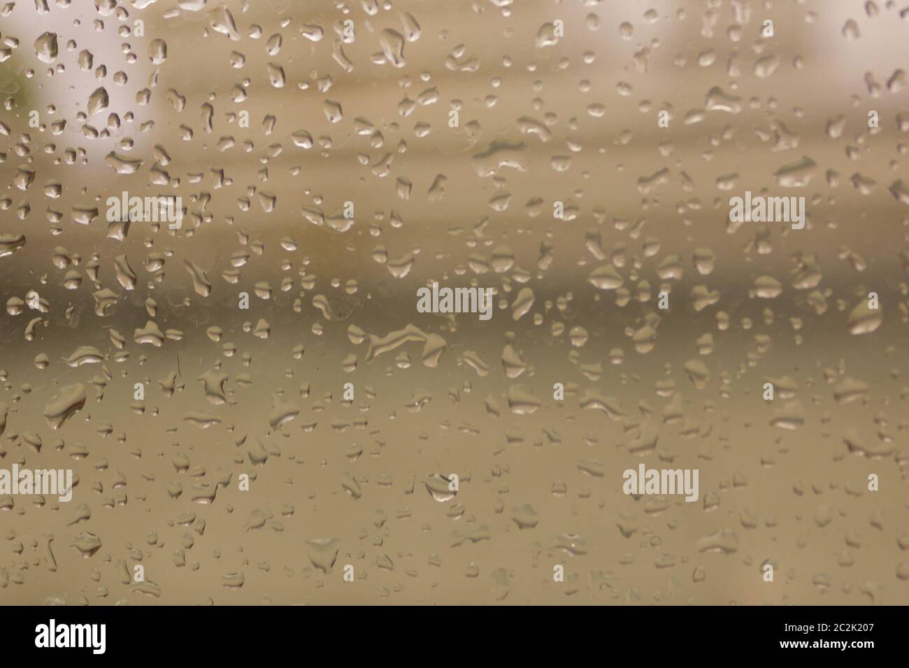 Rain Drops On Surface of wet Window Glass pane In Rainy Season ...
