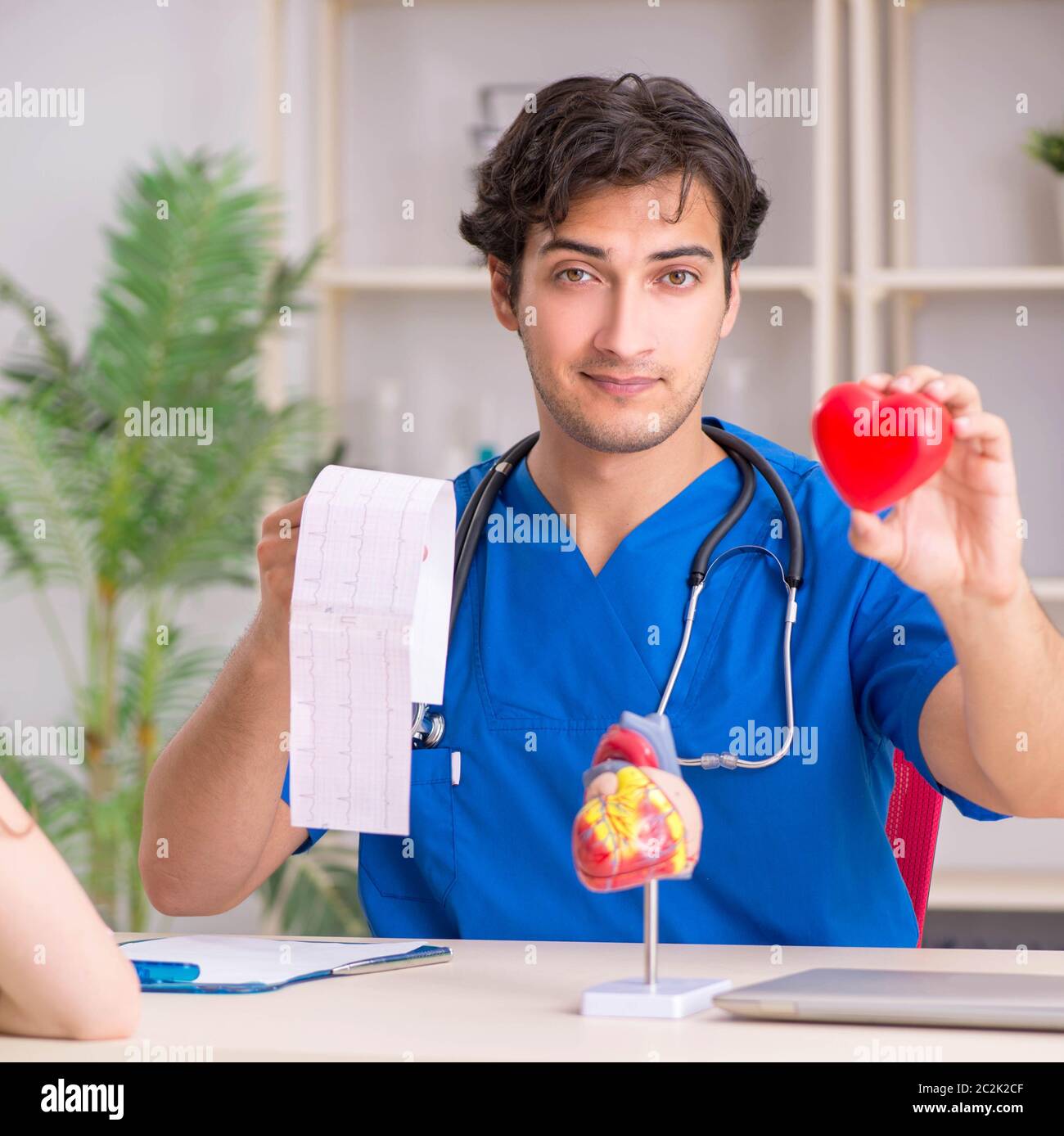 The young patient visiting doctor cardiologist Stock Photo - Alamy