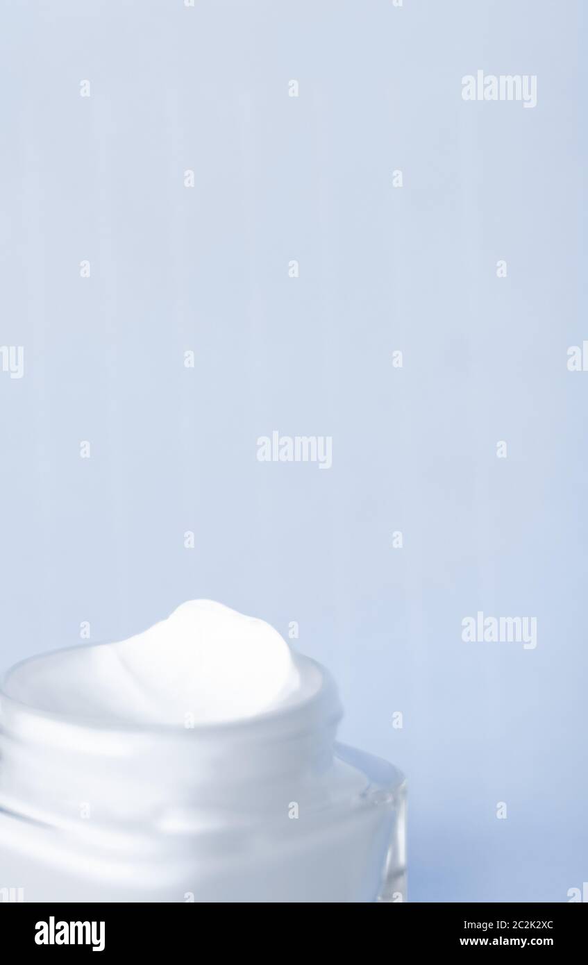 Face cream moisturizer jar on blue background, moisturizing skin care ...