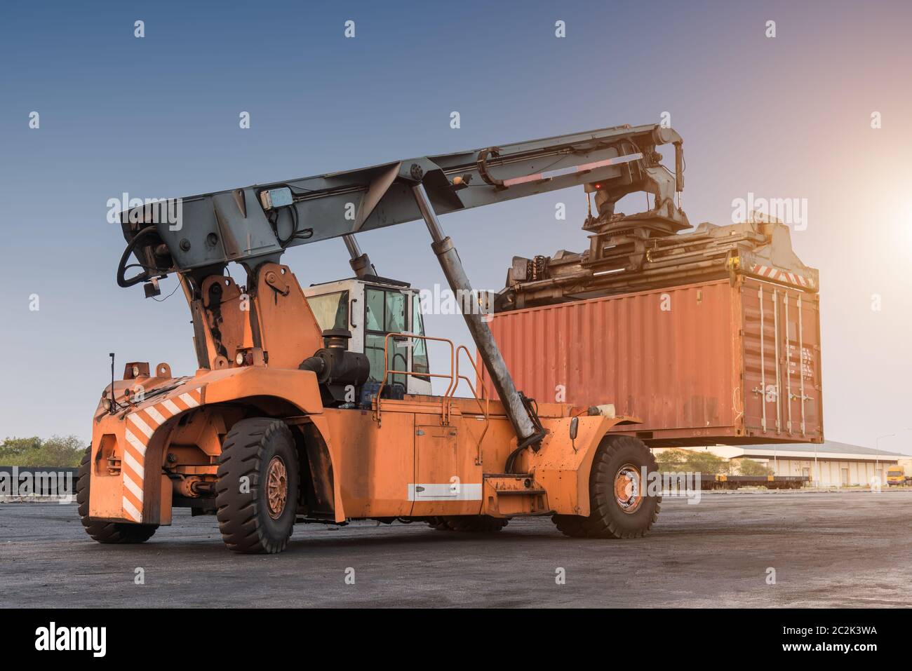 Forklift handling container box loading at the Docks with Truck Stock ...