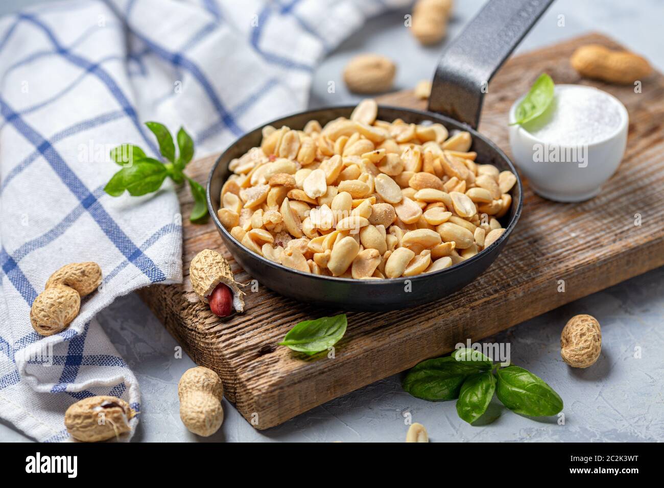 Delicious salted peanuts in a frying pan Stock Photo - Alamy