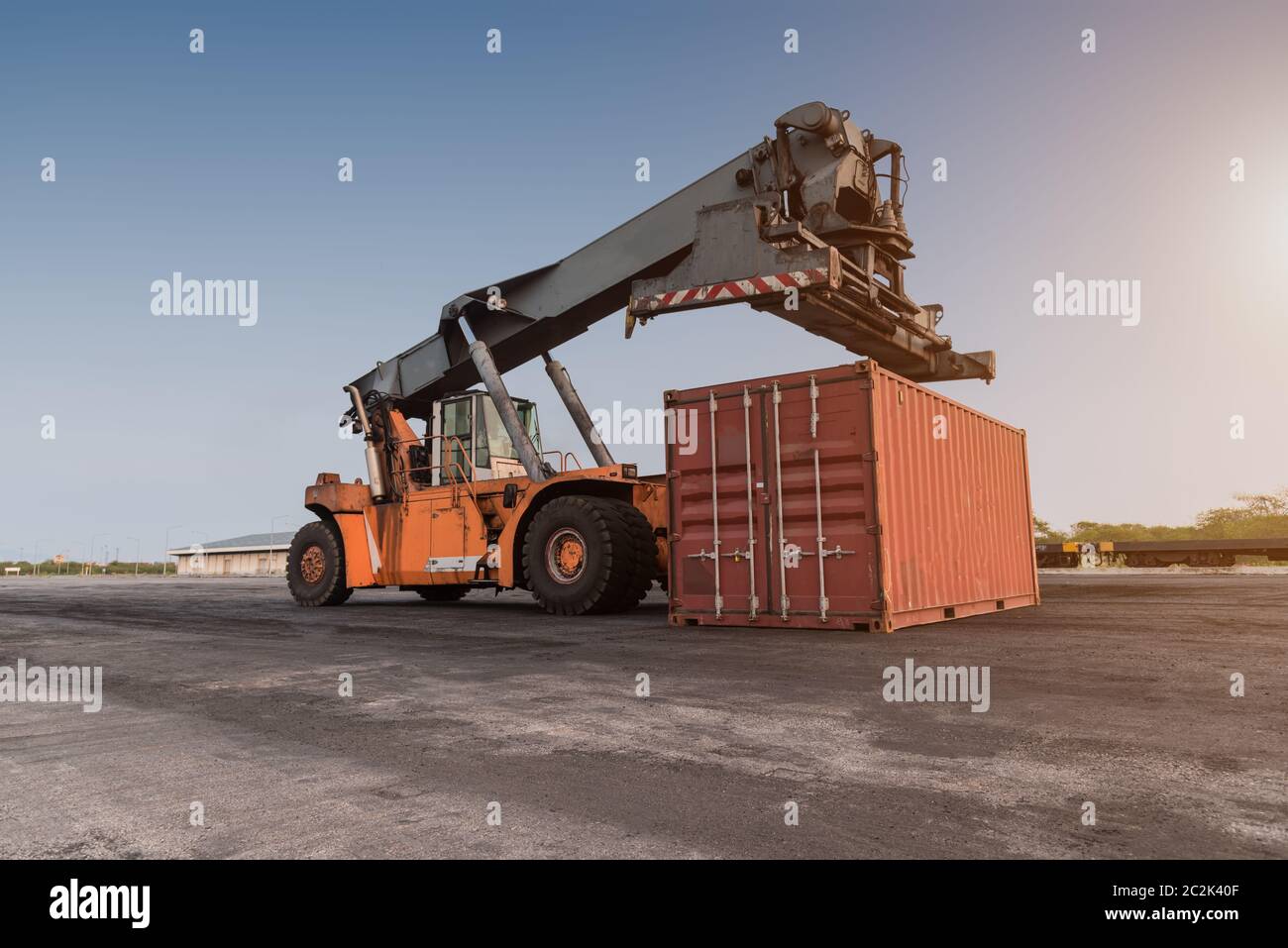 Forklift handling container box loading at the Docks with Truck Stock ...