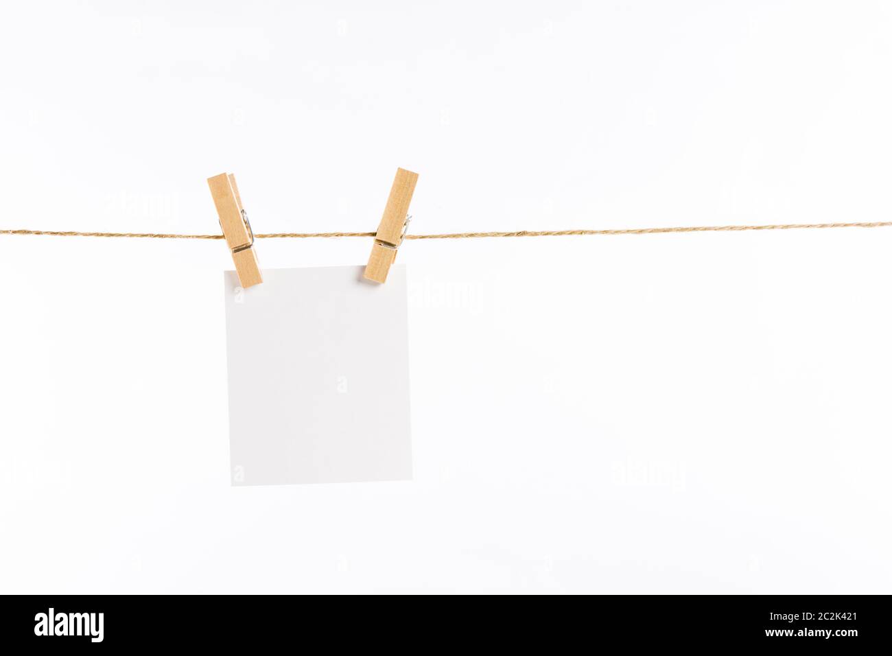 paper cards hanging rope isolated on white background Stock Photo - Alamy