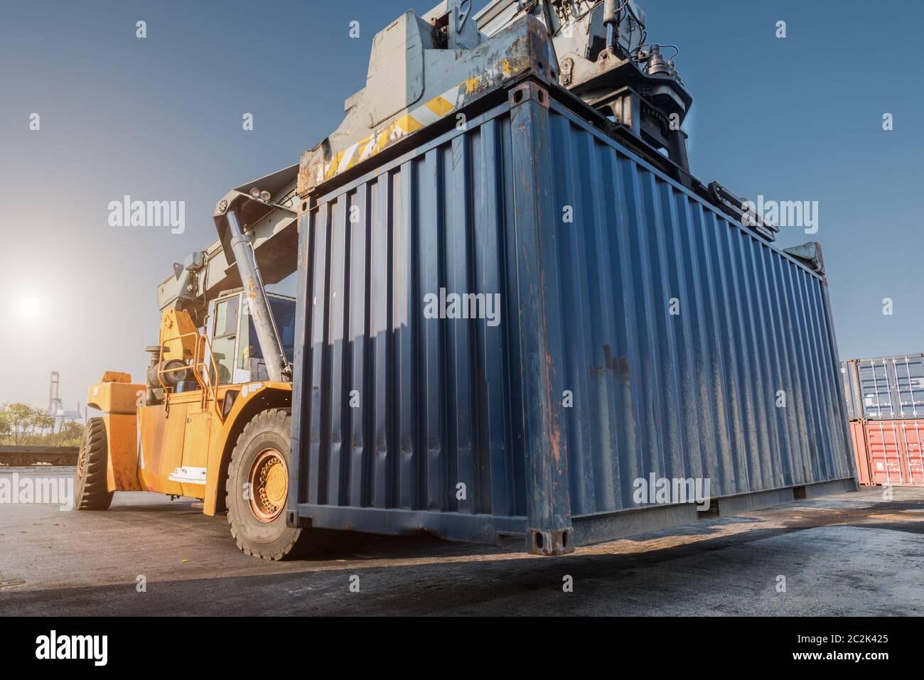 forklift handling container box loading from dock to truck Stock Photo ...