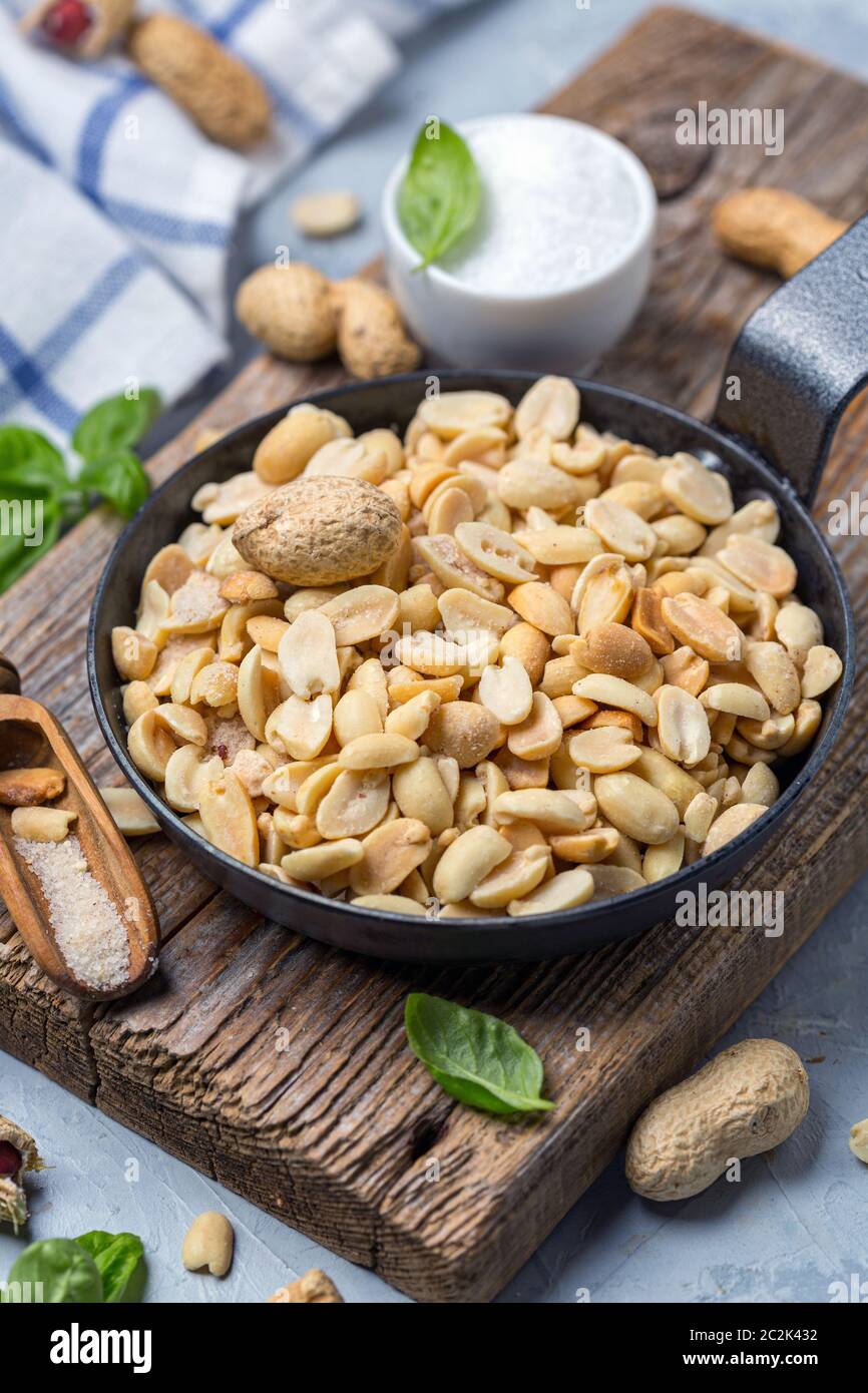 Metal pan with salted peanuts Stock Photo - Alamy