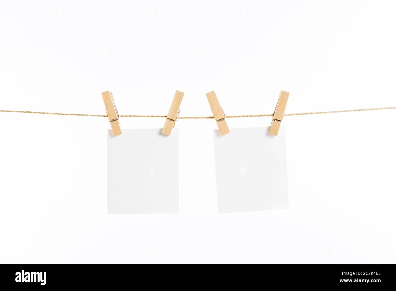 paper cards hanging rope isolated on white background Stock Photo - Alamy