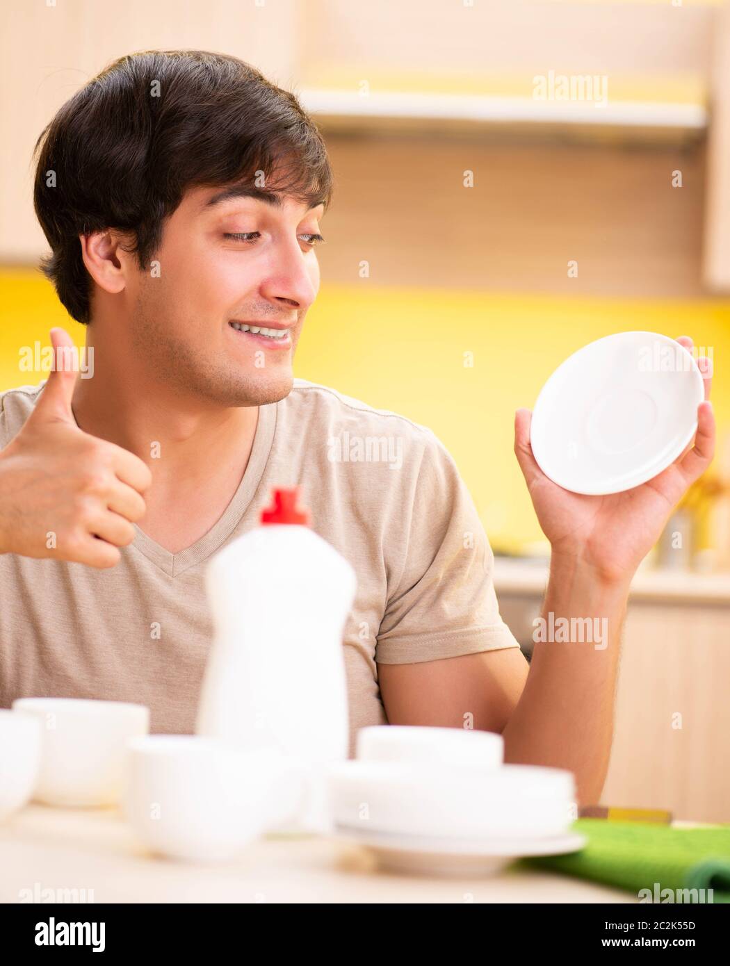 The man washing dishes at home Stock Photo - Alamy