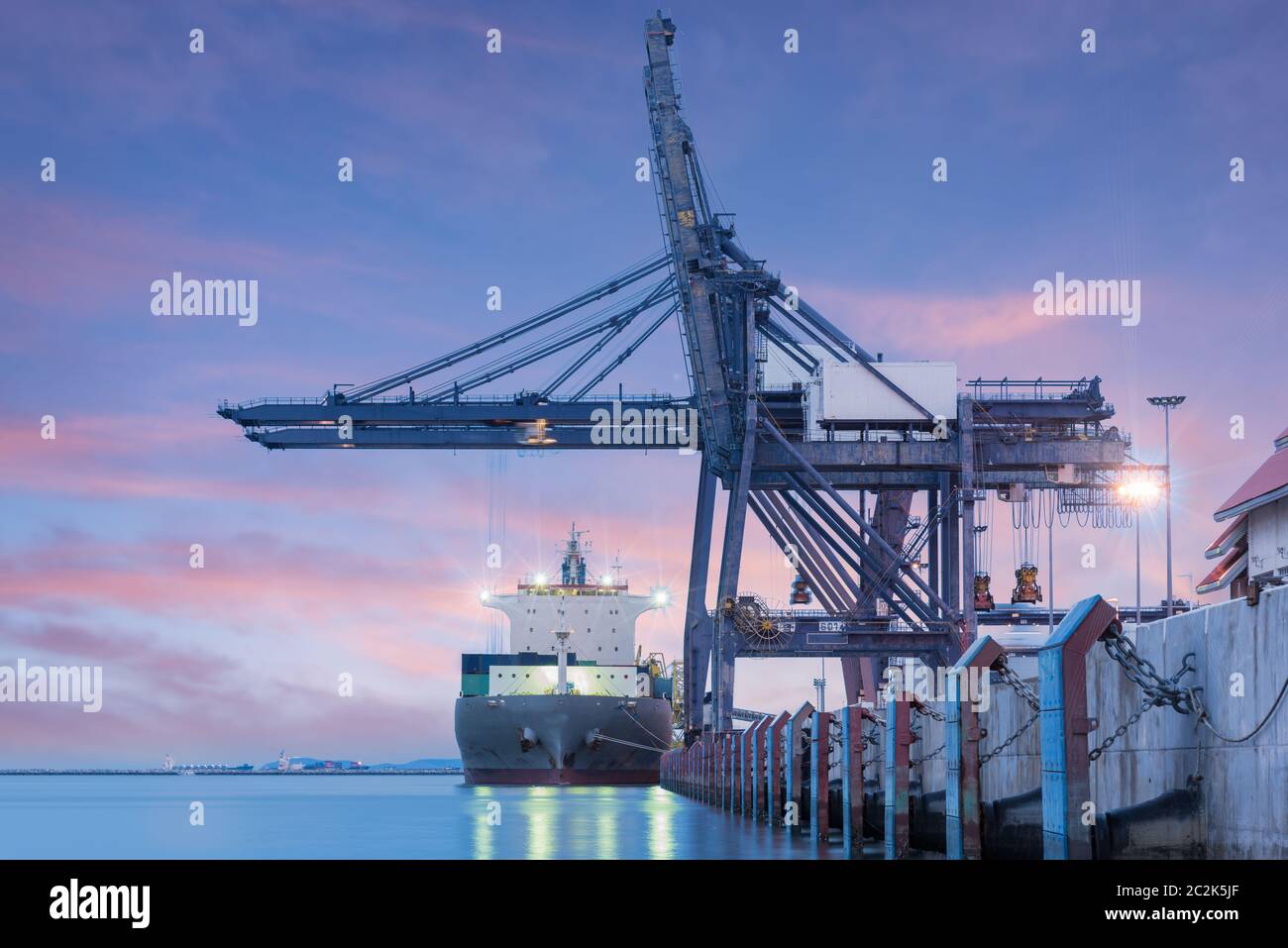 Container Cargo freight ship by crane bridge, logistics harbor at ...