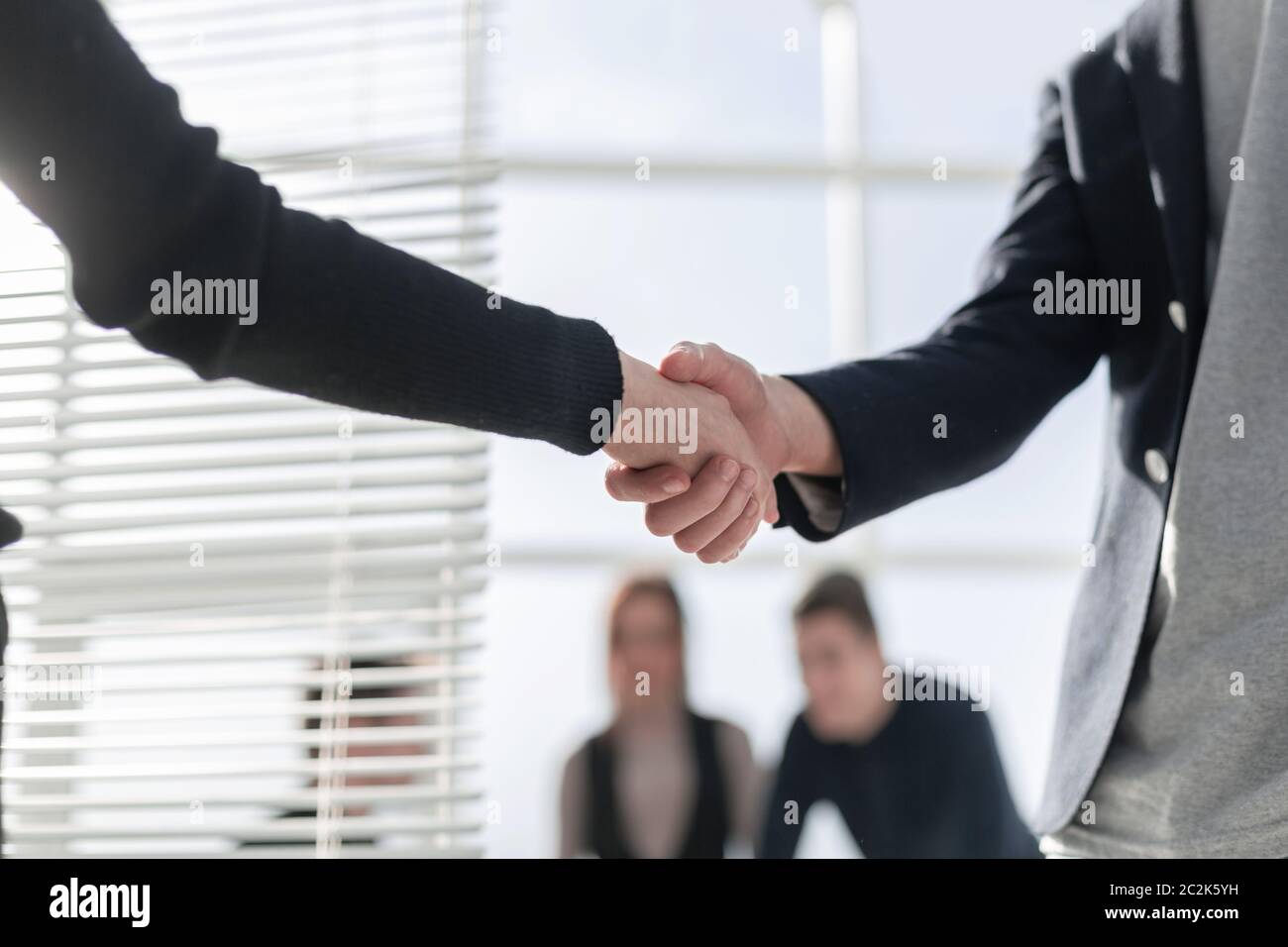 Businessmen making handshake in the city - business etiquette, c Stock ...