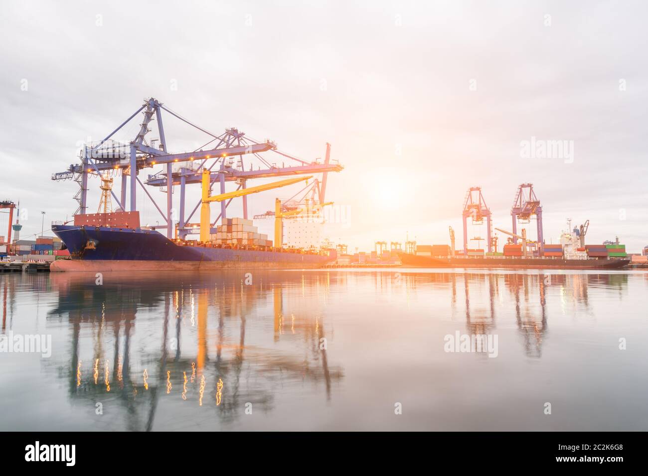 Industrial Container Cargo freight ship with working crane bridge Stock ...