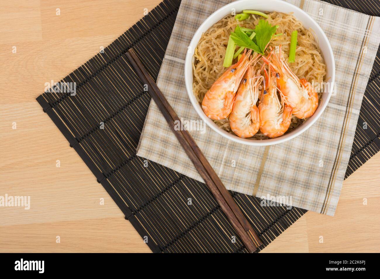 baked vermicelli with shrimp in white cup on wooden background Stock ...