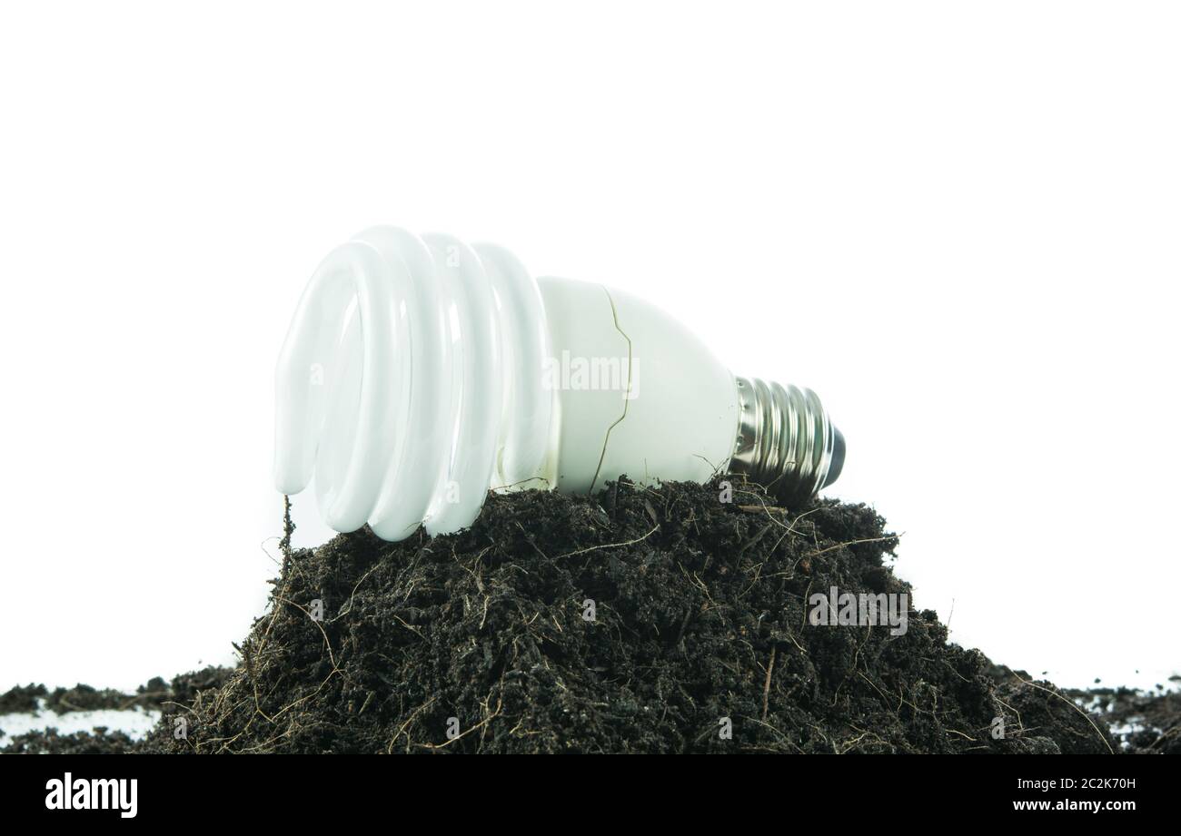 Pile of soil with light bulb green energy concept isolated on over ...