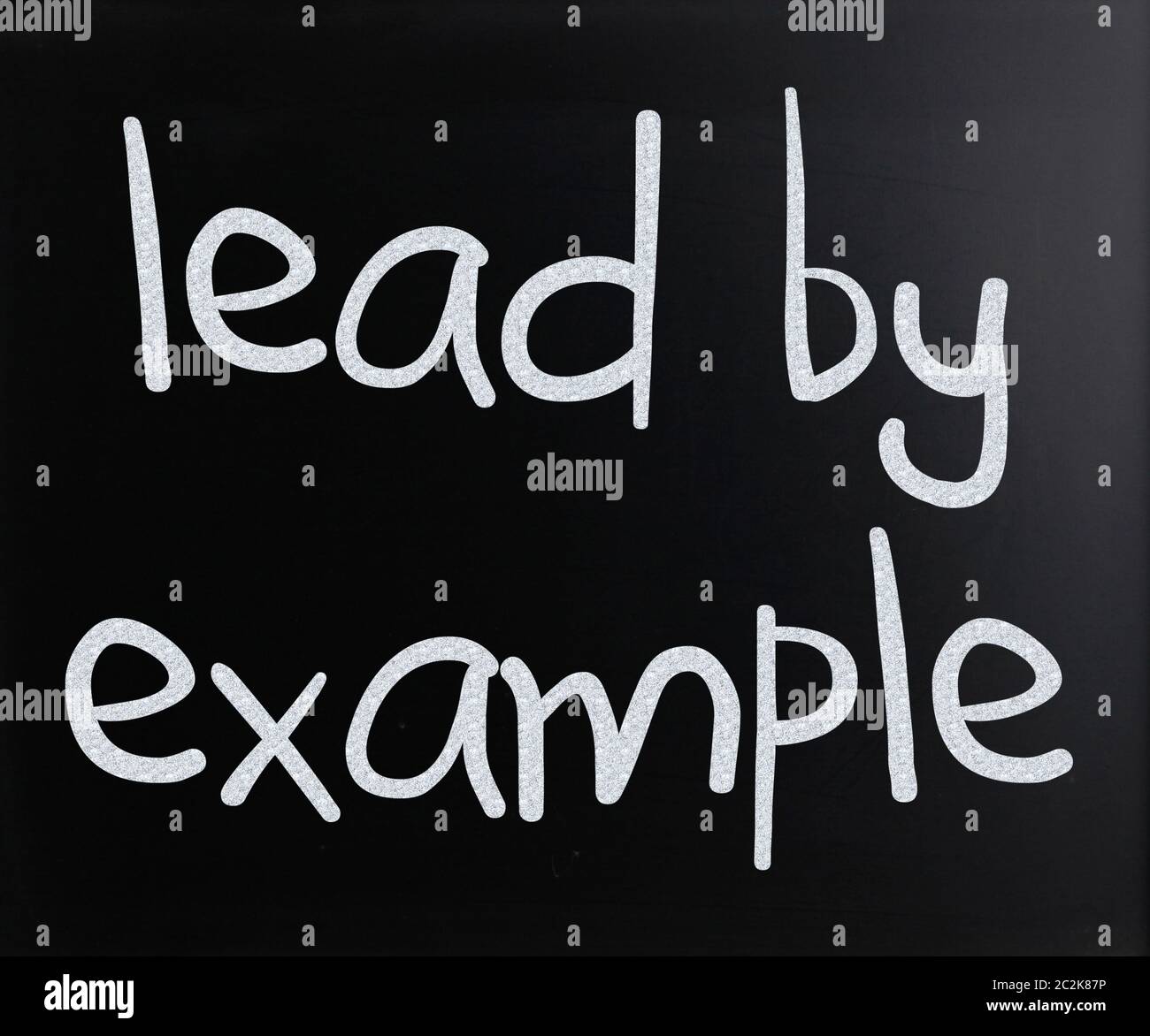 Lead by example handwritten with white chalk on a blackboard Stock ...