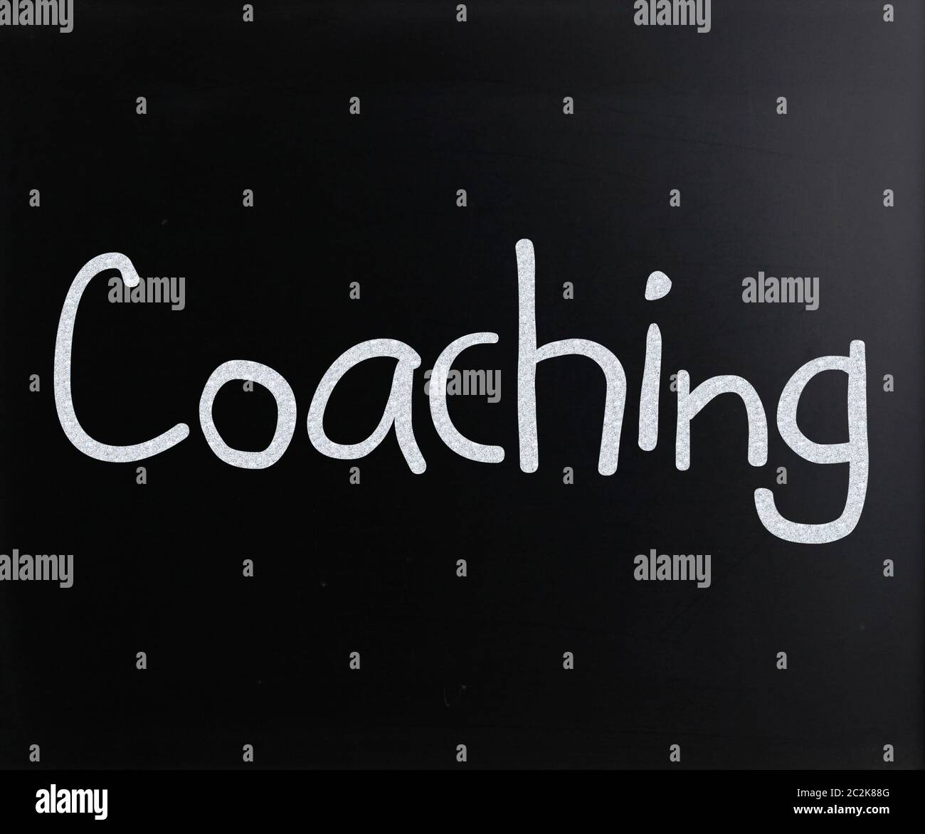 Coaching handwritten with white chalk on a blackboard Stock Photo - Alamy
