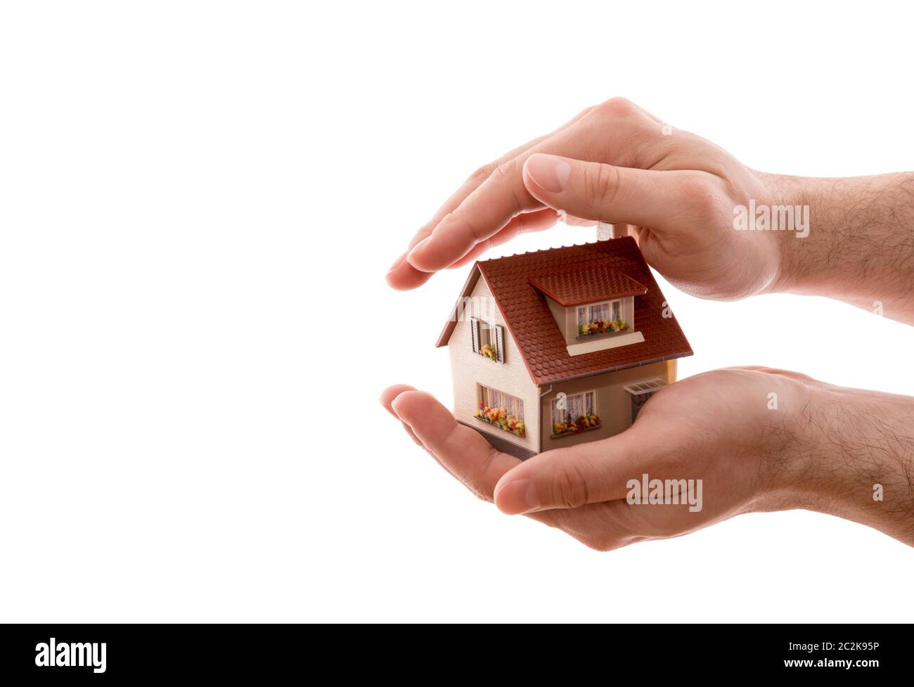 Home protection. Small house covered by hands isolated on white ...