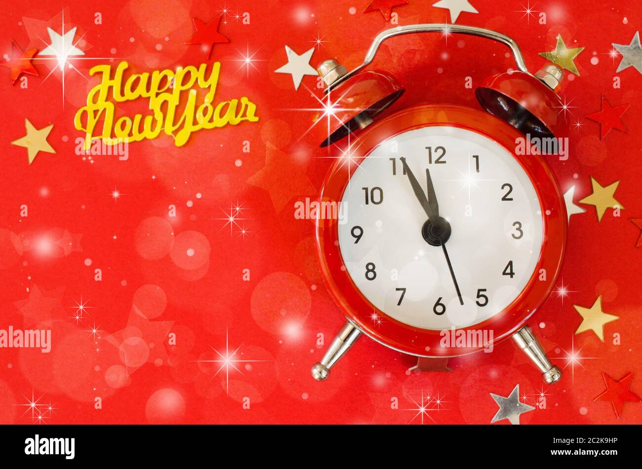 Festive Christmas background with alarm clock on red background in ...