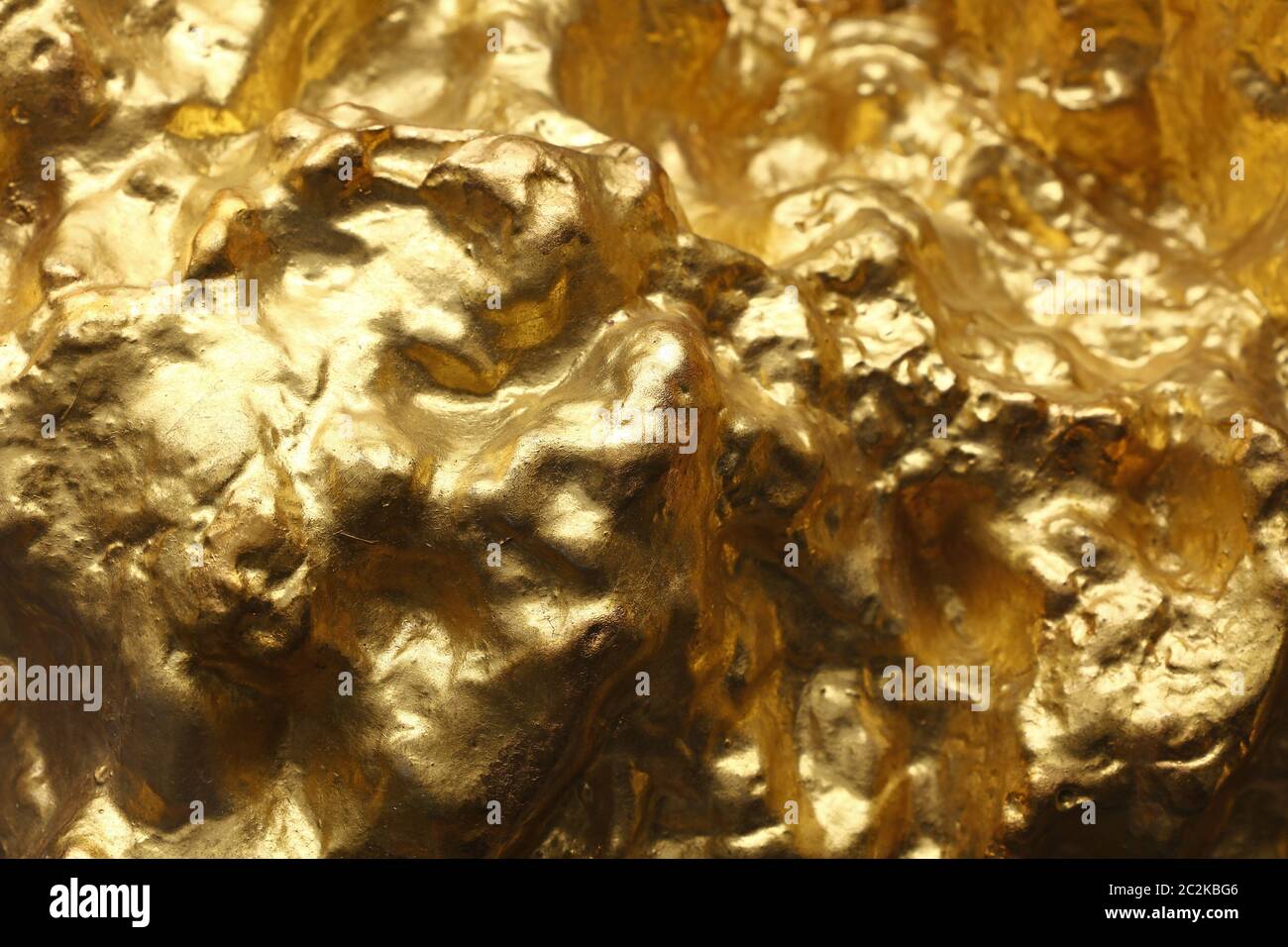 Close up big gold rock slug nugget uneven surface Stock Photo - Alamy