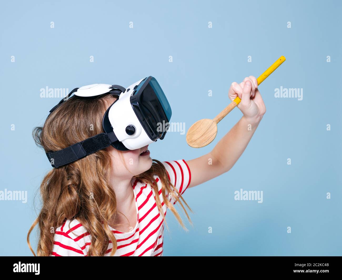 smiling positive girl wearing virtual reality glasses goggles headset ...