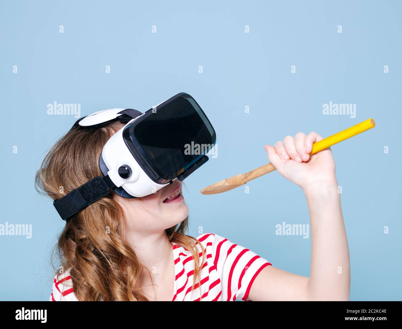 smiling positive girl wearing virtual reality glasses goggles headset ...