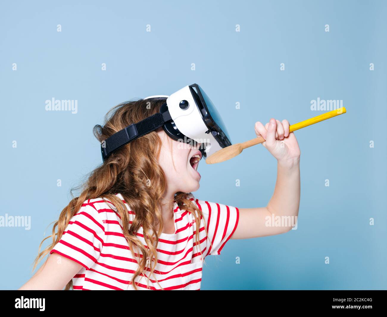 smiling positive girl wearing virtual reality glasses goggles headset ...
