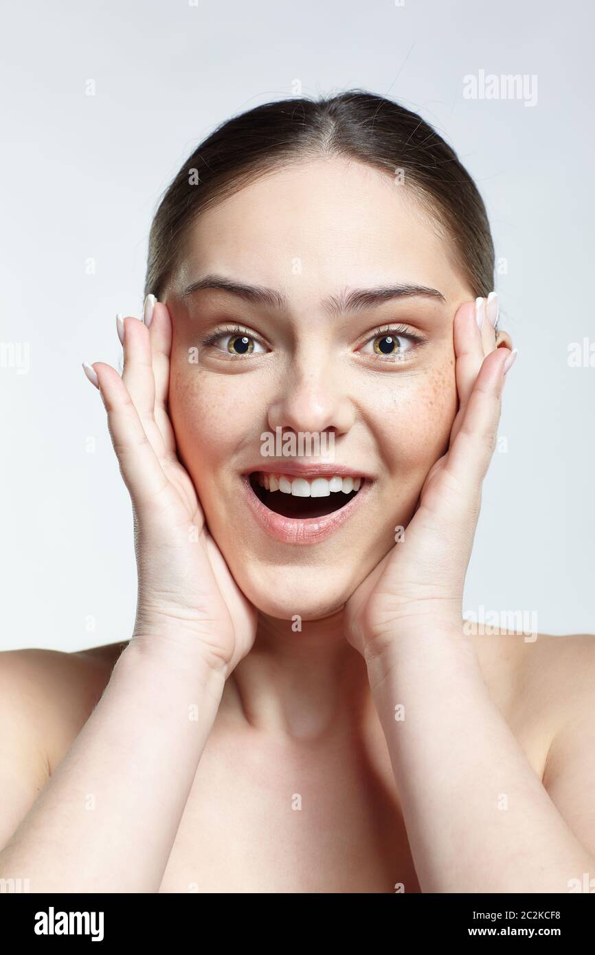 Emotional young woman face portrait with wonder facial expression ...