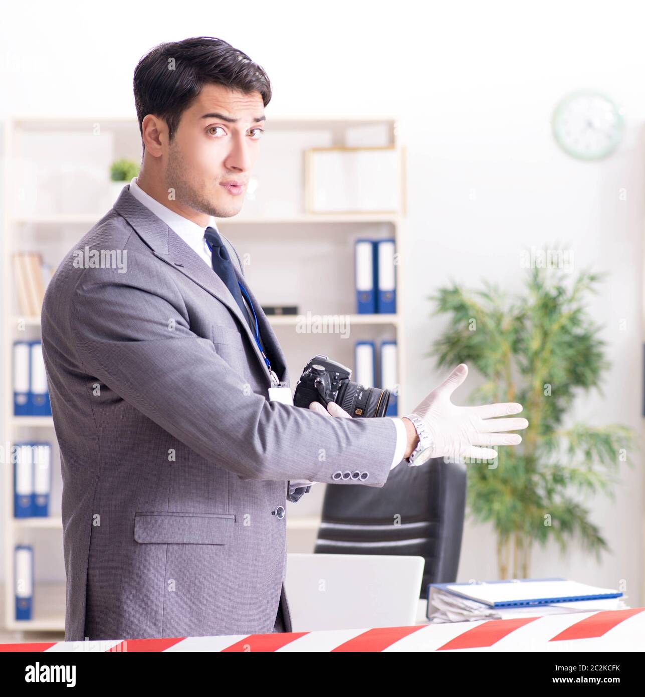 The forensics investigator at the scene of office crime Stock Photo - Alamy